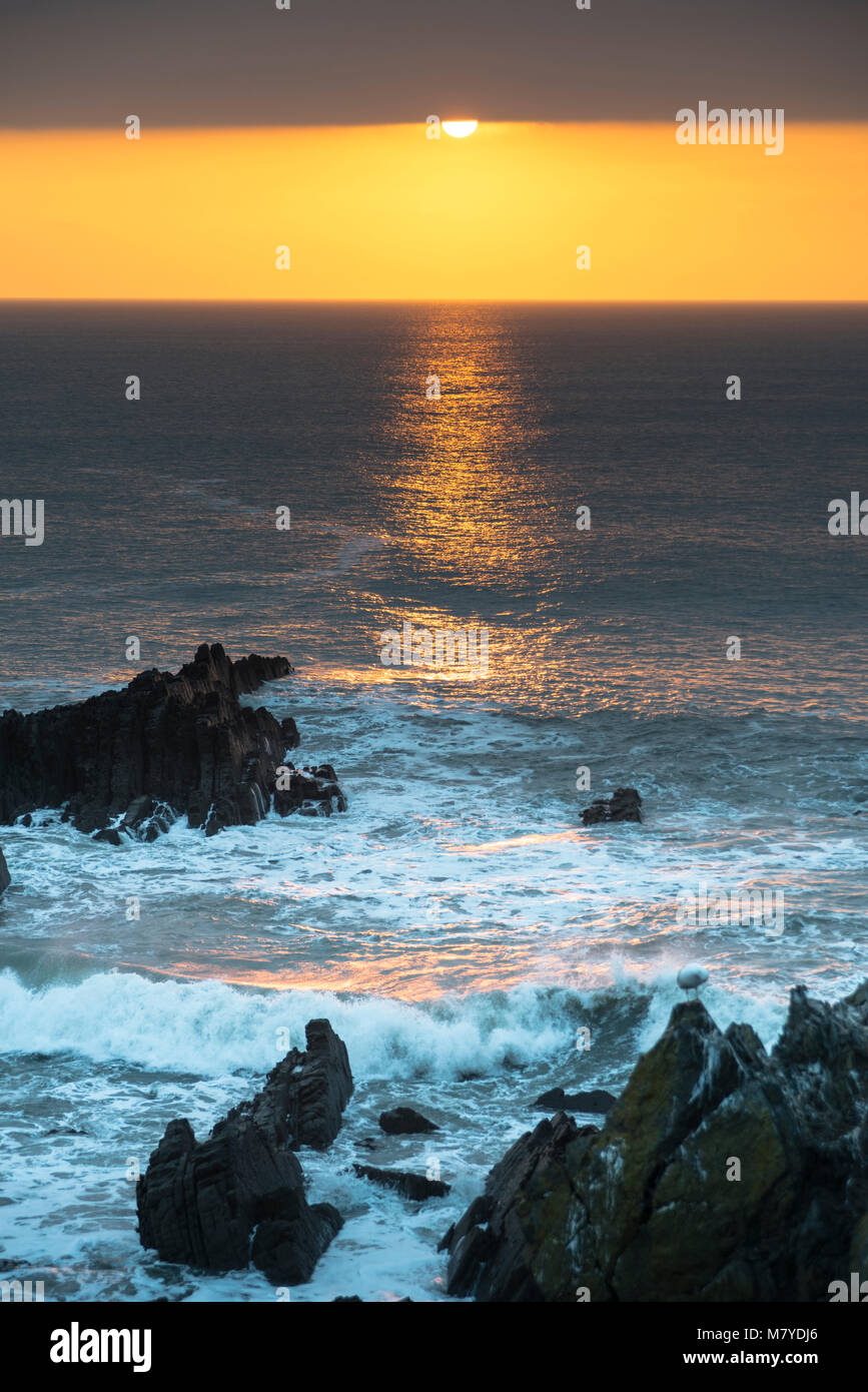 Sunset over the sea at Hartland Quay North Devon Stock Photo - Alamy