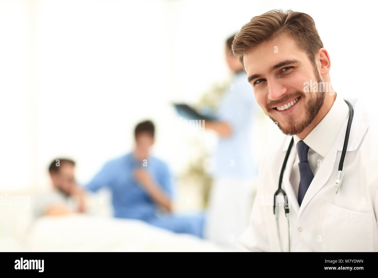 closeup.smiling doctor on blurred background Stock Photo - Alamy