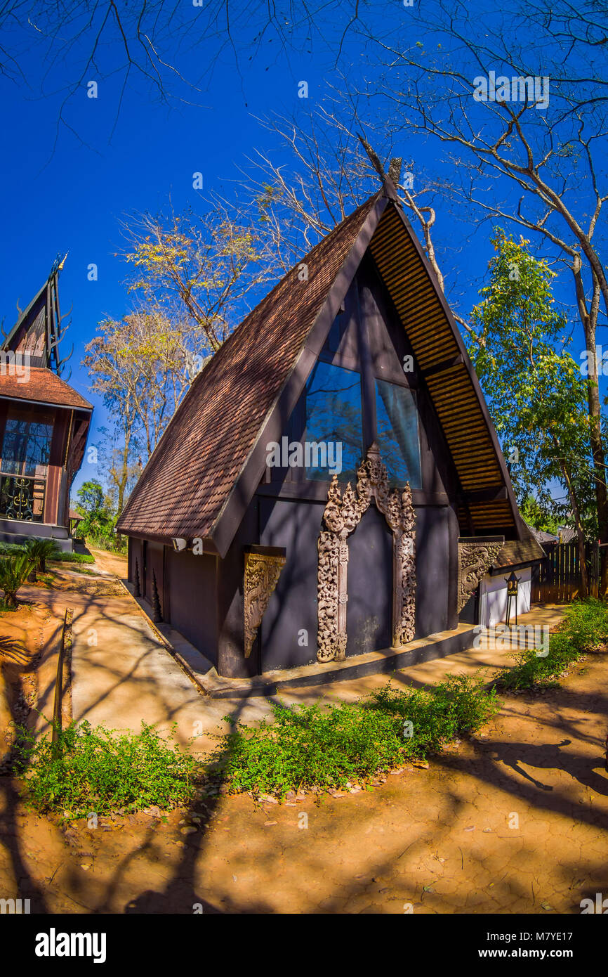 Outdoor view of many houses in Baan Dam museum, the Black House in ...