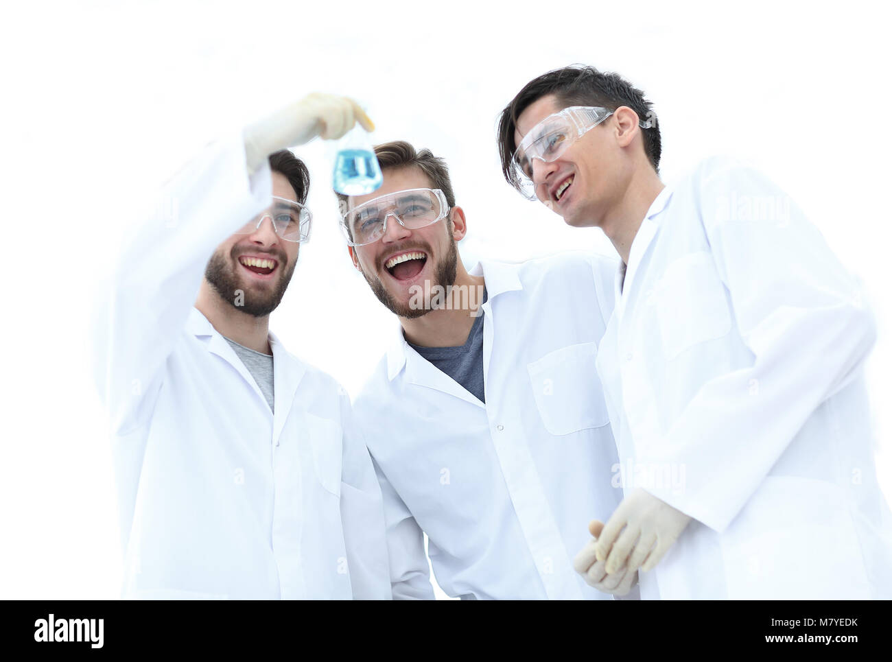 Scientists in lab looking beaker hi-res stock photography and images ...