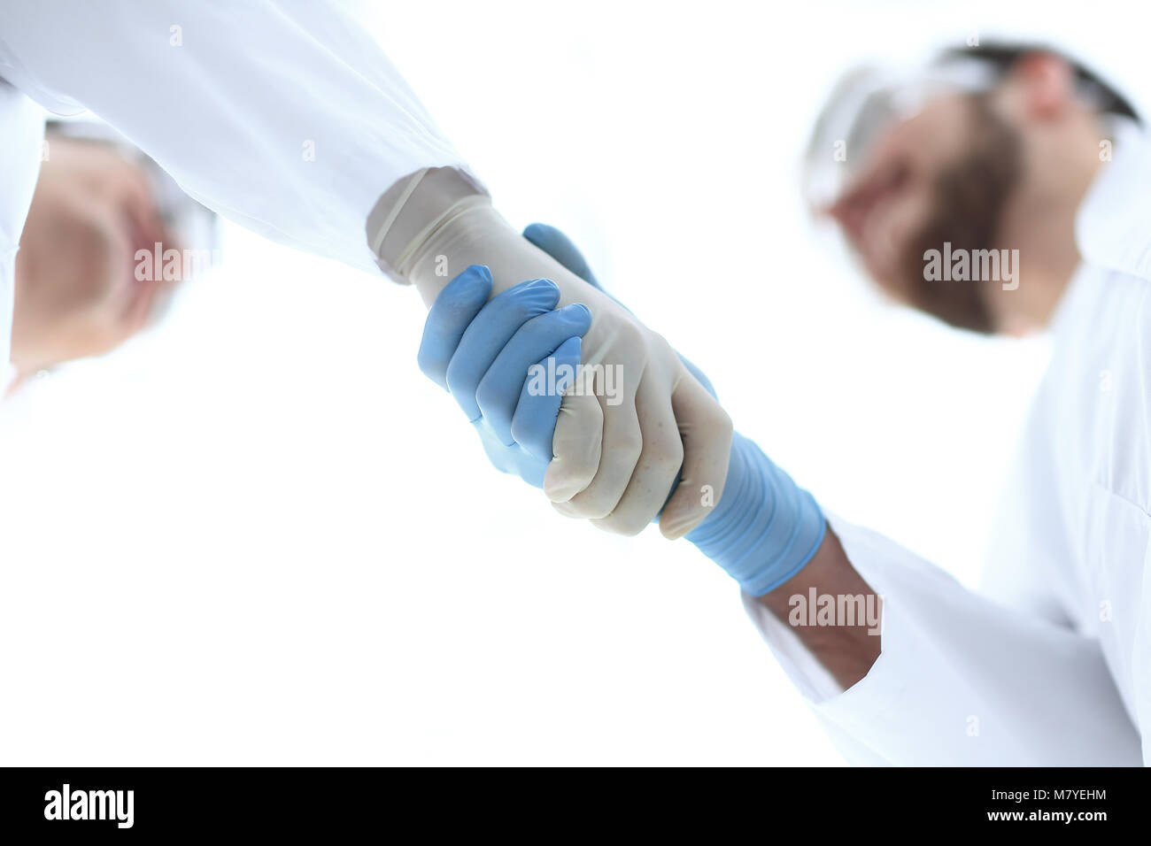 closeup.two scientists shake hands Stock Photo - Alamy