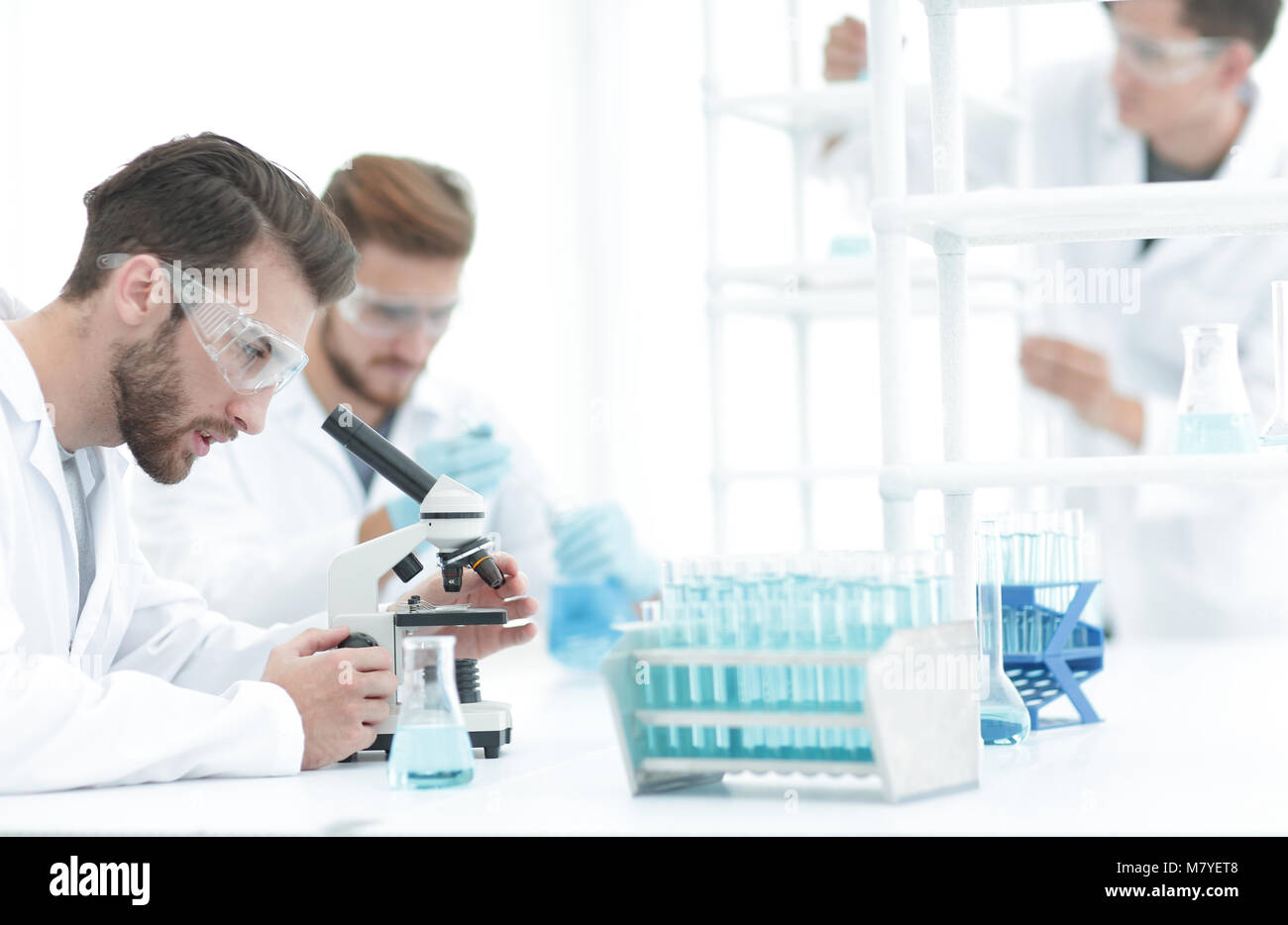 biologist explores the substance under the microscope Stock Photo - Alamy
