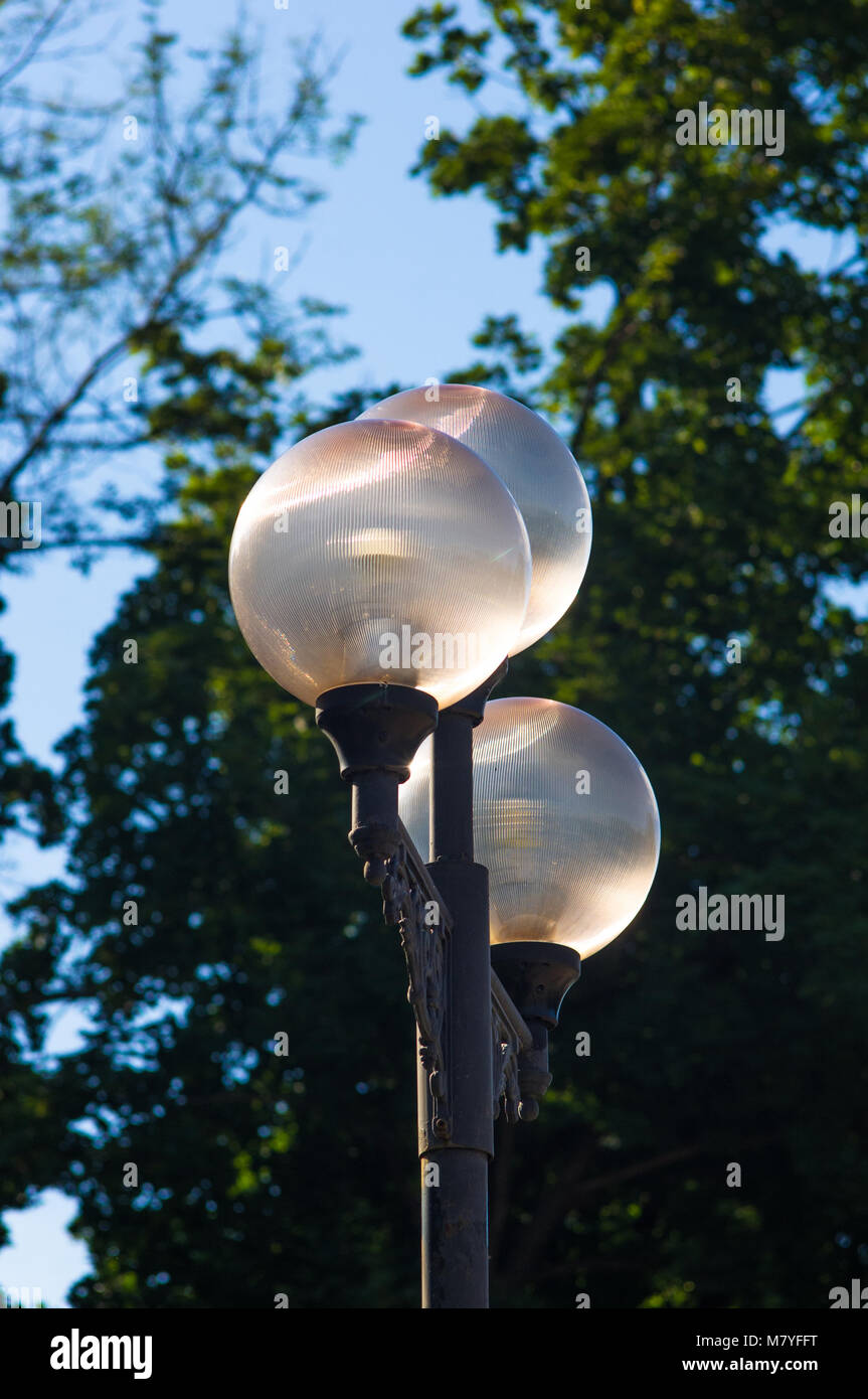 city skyline - classic lamp post with locks of lovers at sunset Stock ...