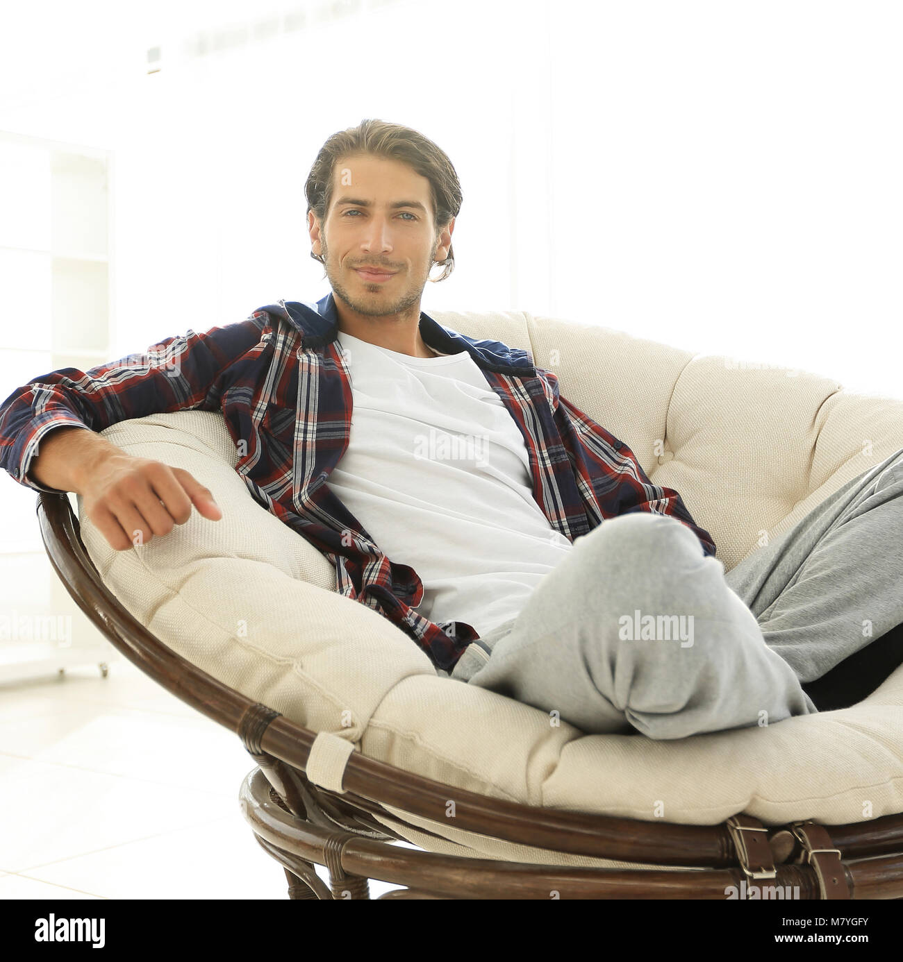 successful guy resting in modern living room Stock Photo - Alamy