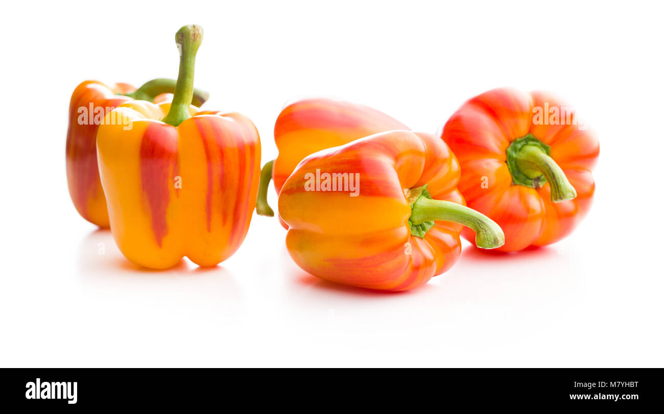 Double color bell peppers isolated on white background Stock Photo - Alamy