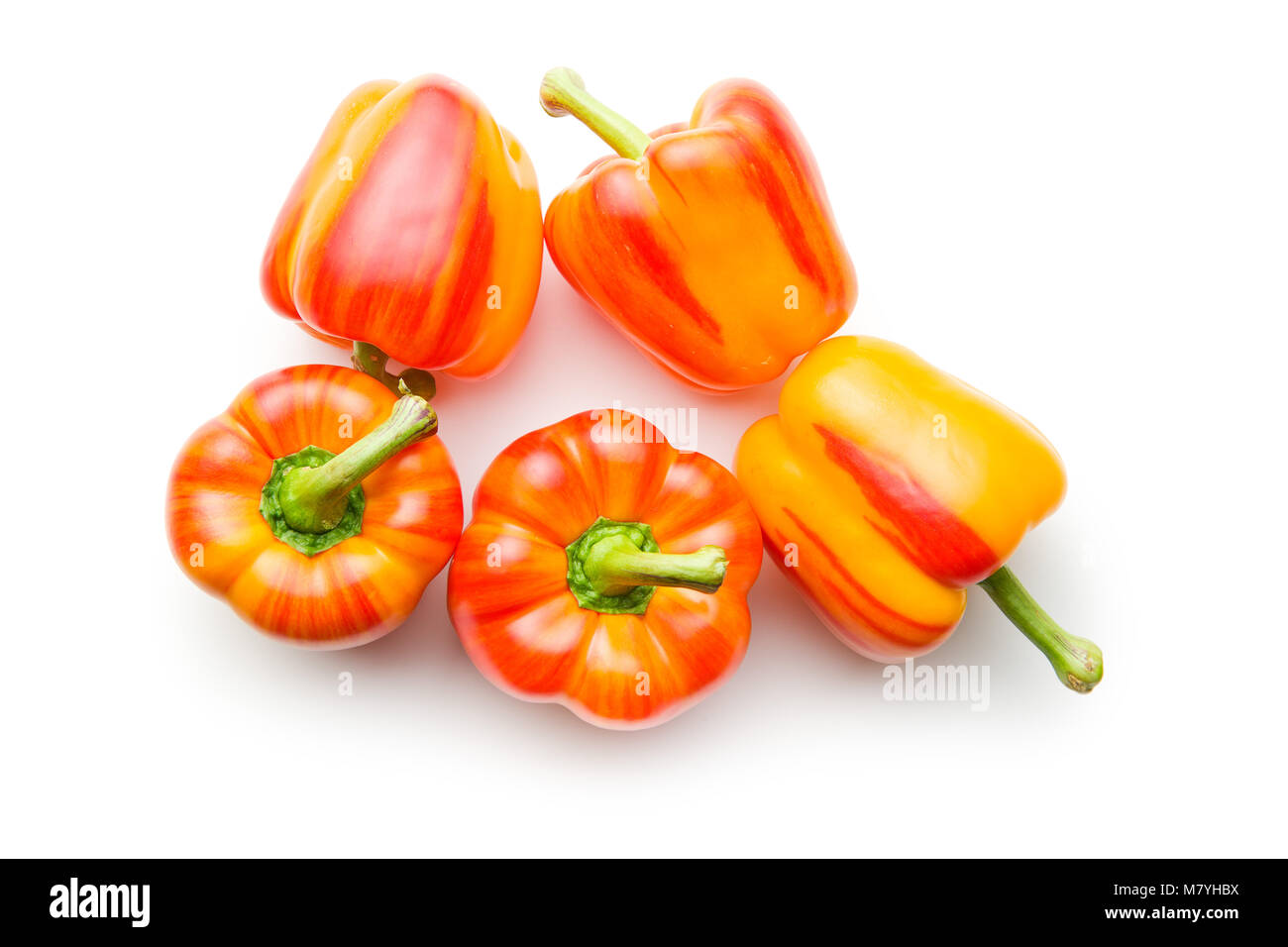 Double color bell peppers isolated on white background Stock Photo - Alamy