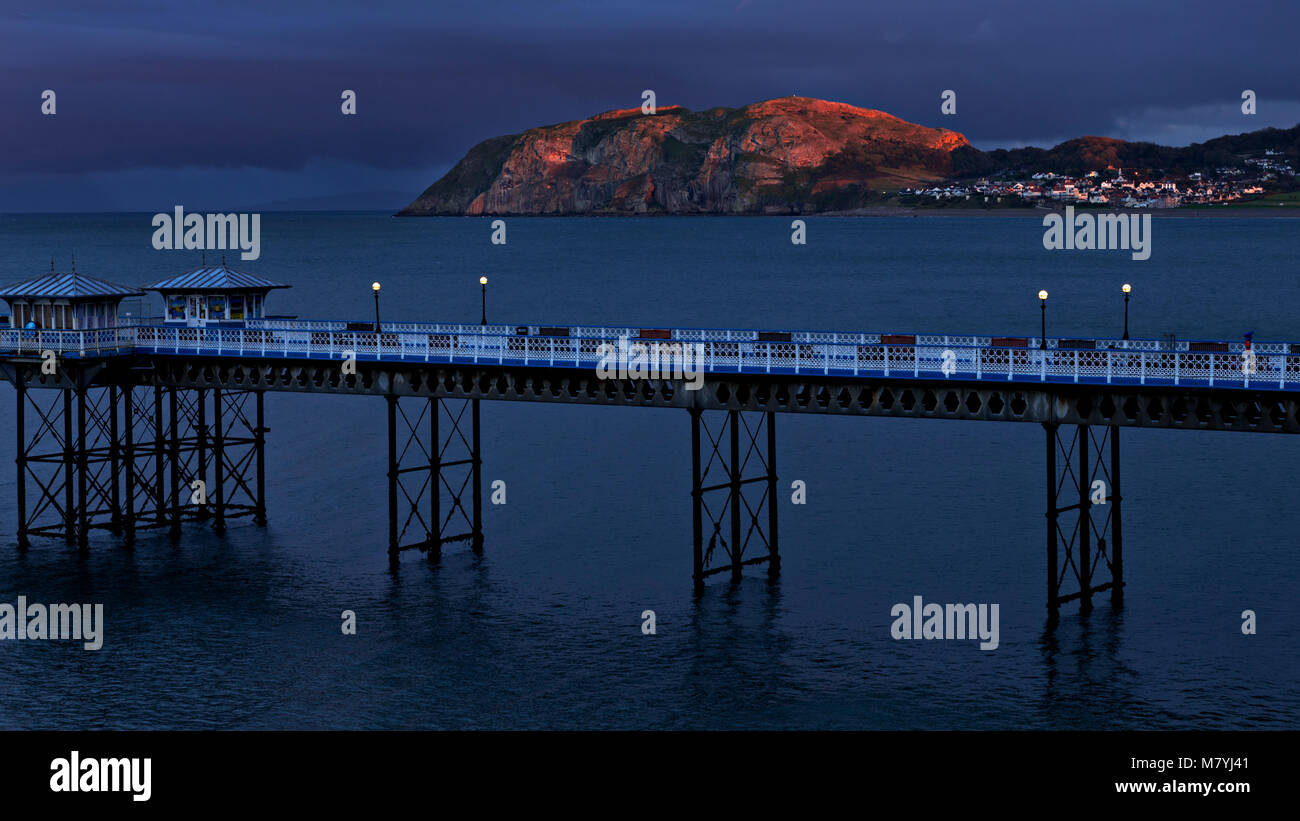 Llandudno pier at sunset on the North Wales coast with the Little Orme ...