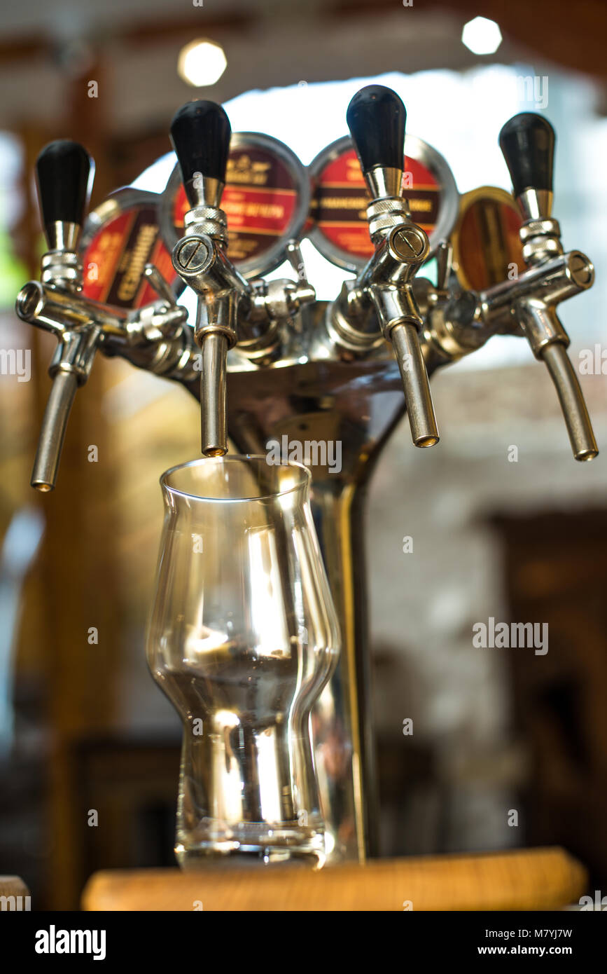 A beer filling stand, with empty glass Stock Photo - Alamy