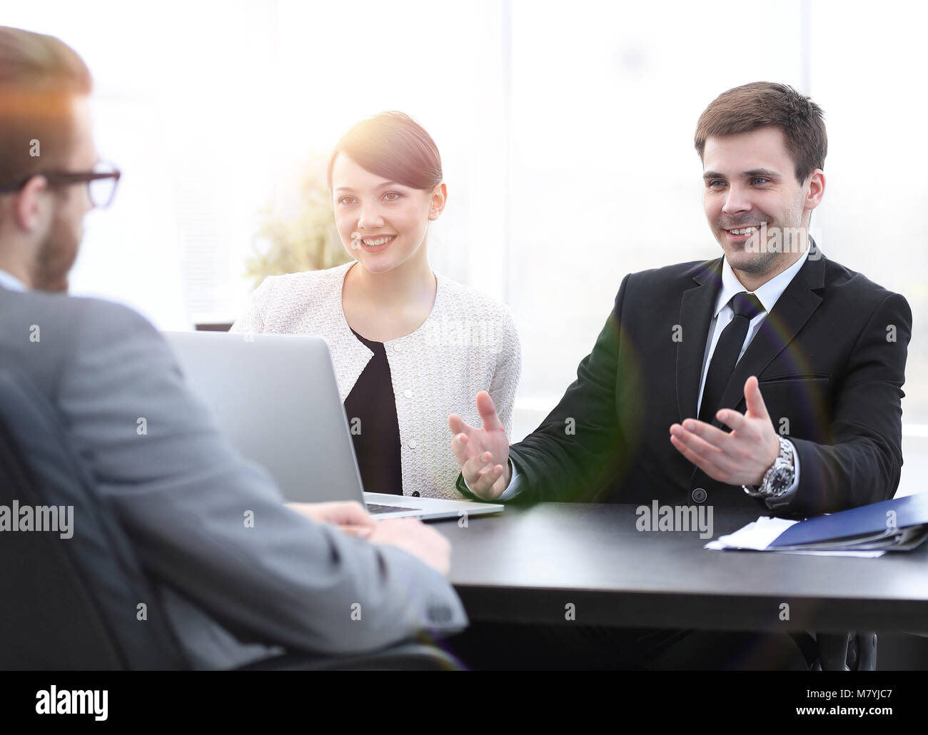 employees communicate with the customer in the office Stock Photo - Alamy