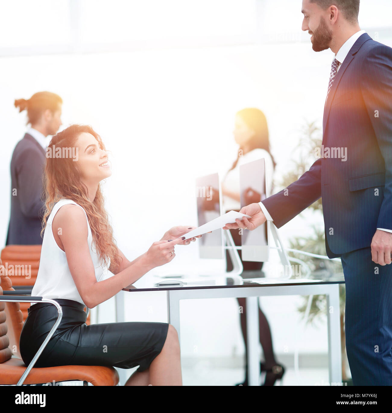 Manager in office handing hi-res stock photography and images - Alamy