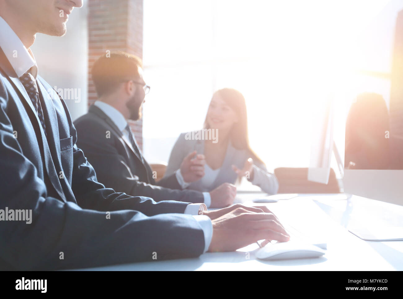 office employees sitting at their work Desk Stock Photo - Alamy