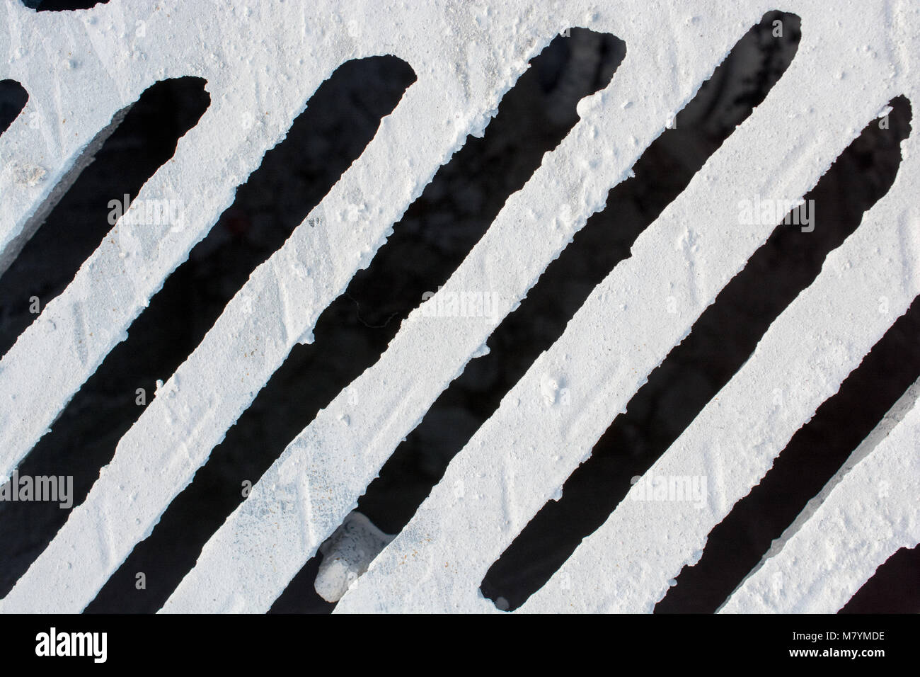 Pattens formed with a concrete background Stock Photo - Alamy