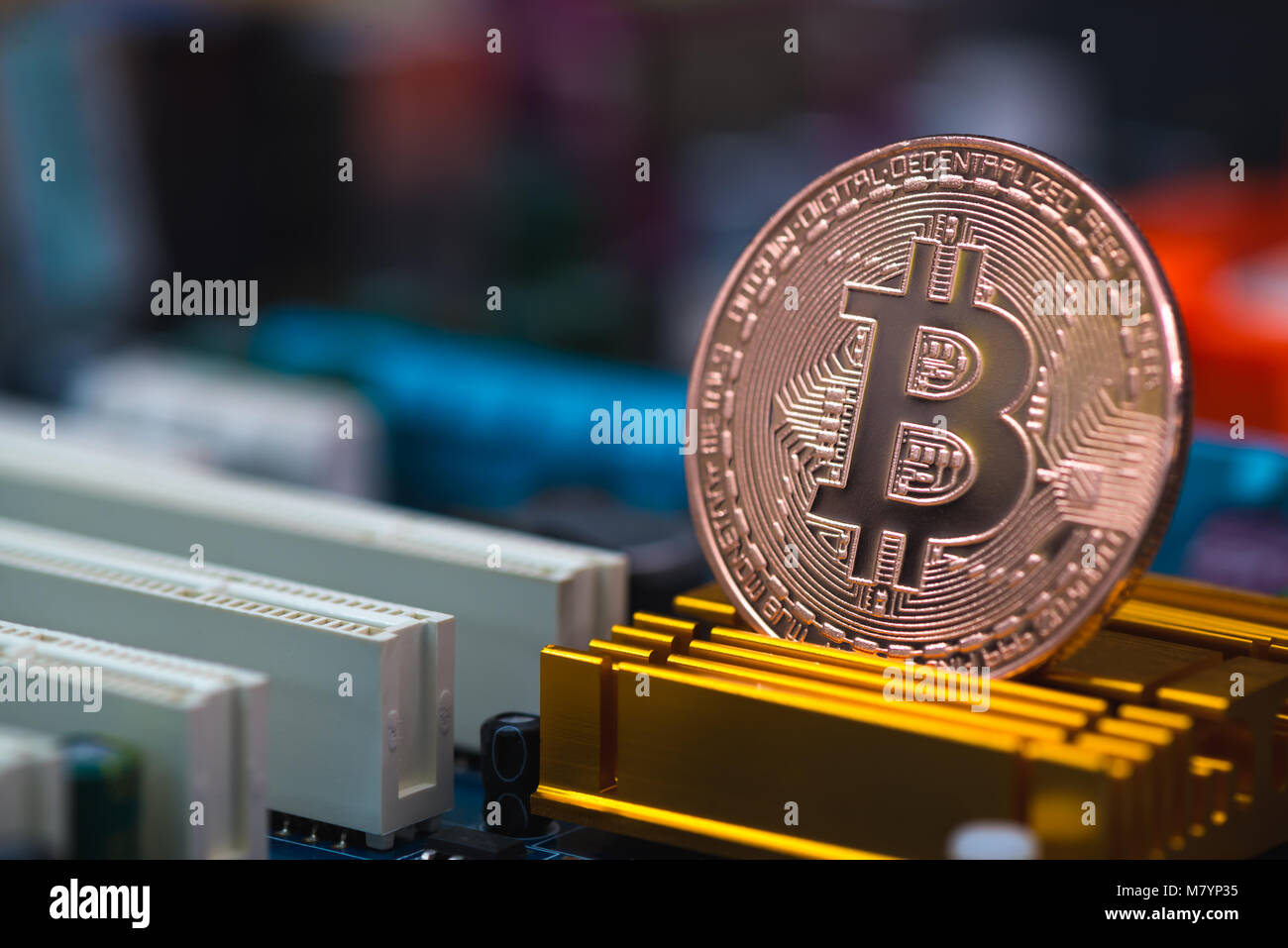Bitcoin digital currency, bit-coin on motherboard or electronic board ...