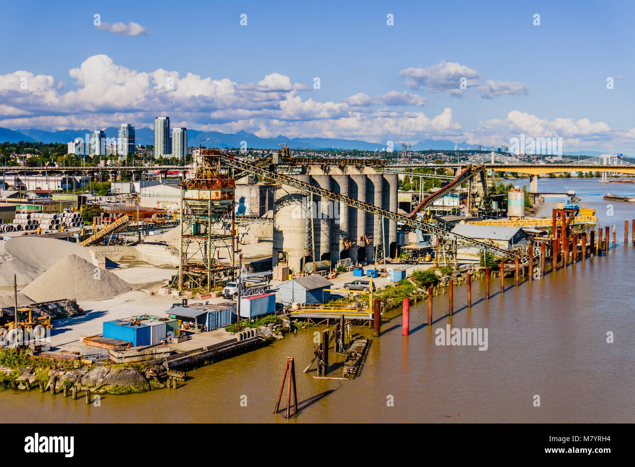 Crane building against backdrop mountains hi-res stock photography and ...