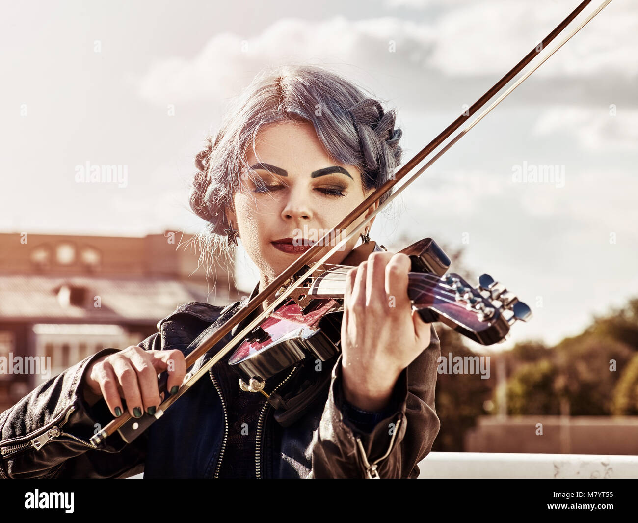 Woman perform music on violin park outdoor. Girl performing jazz Stock ...
