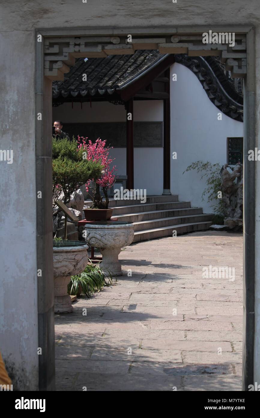 Gateway into a Chinese garden Stock Photo - Alamy