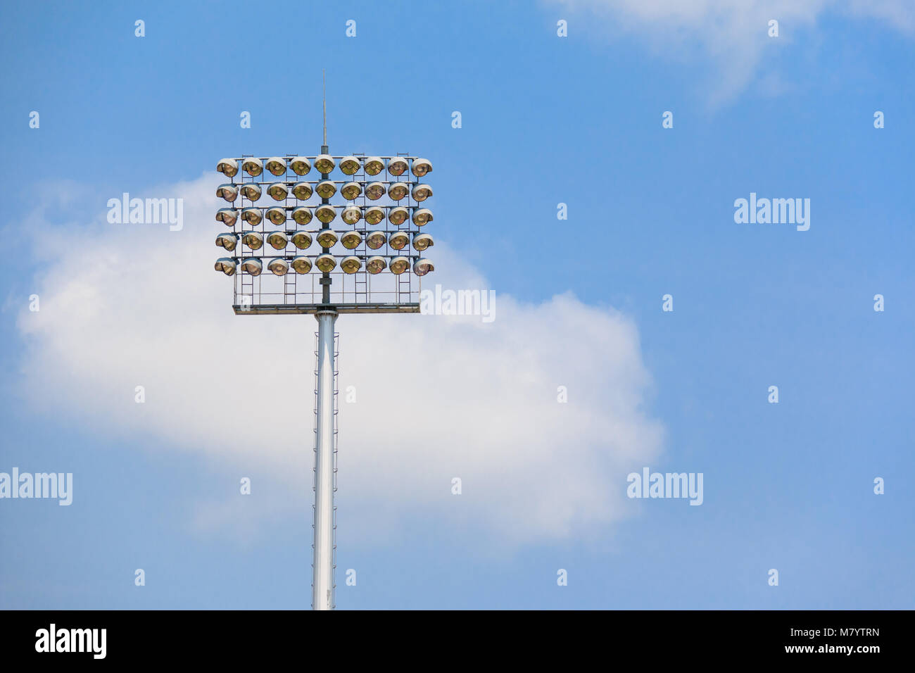 Stadium Light Poles on Sky and cloud Stock Photo - Alamy