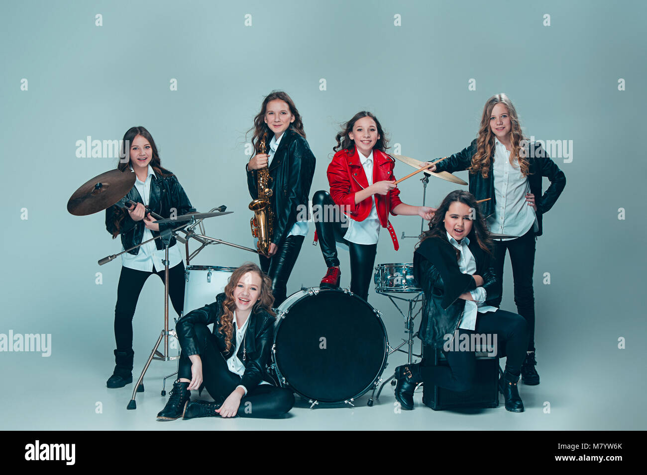 The teen music band performing in a recording studio Stock Photo - Alamy