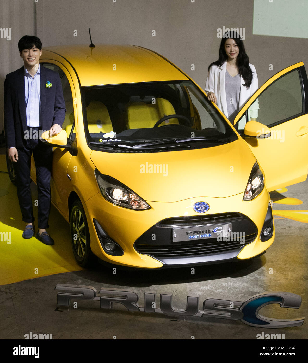 Toyota's Prius C compact hybrid hatchback debuts in Seoul Models stand ...