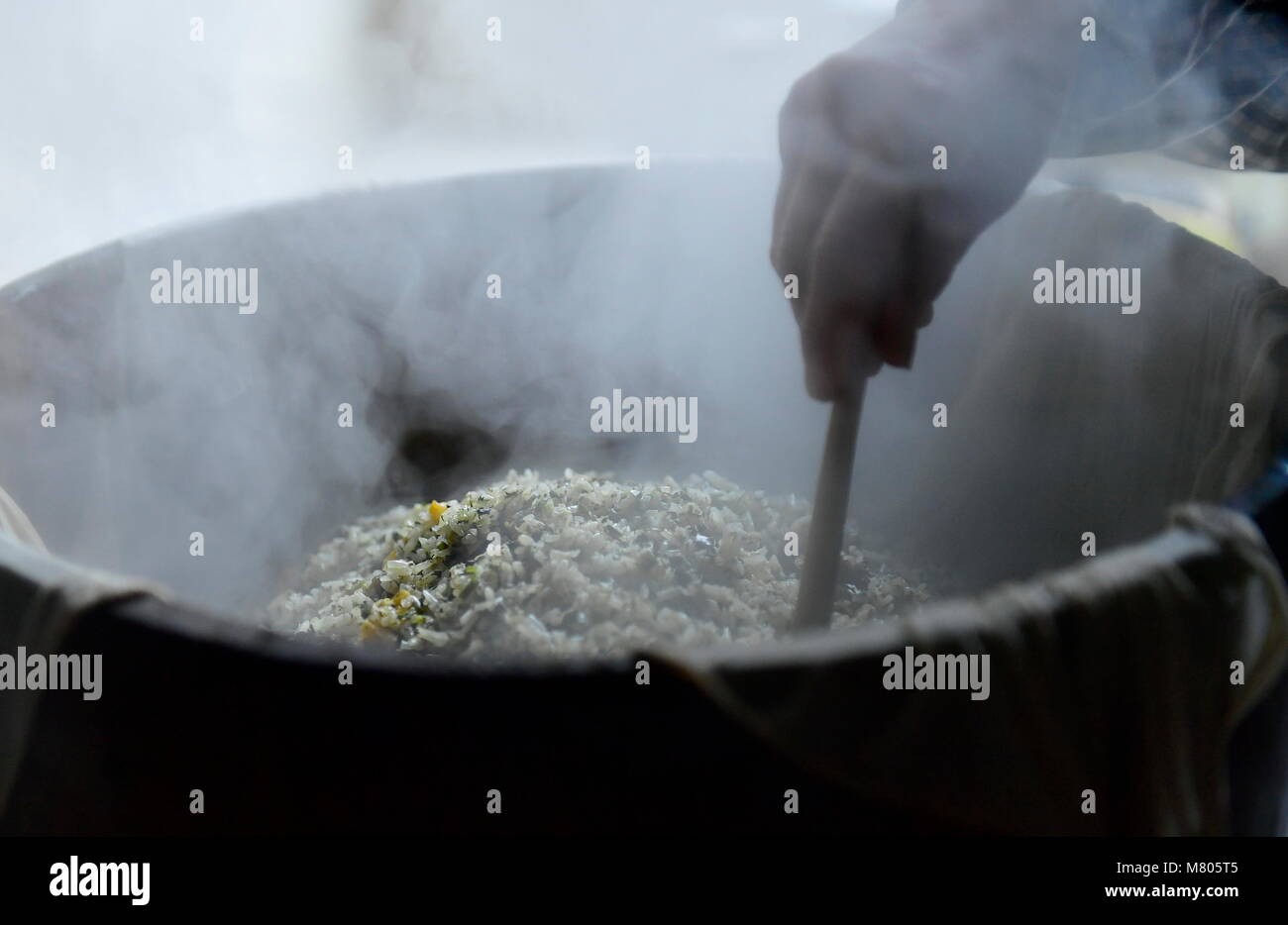 Xuan'en, China's Hubei Province. 14th Mar, 2018. A villager cooks ...