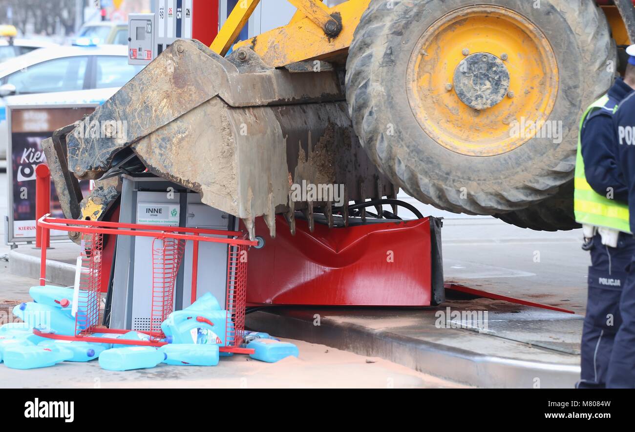A digger smashes a distributor at Orlen petrol station on March 13 ...