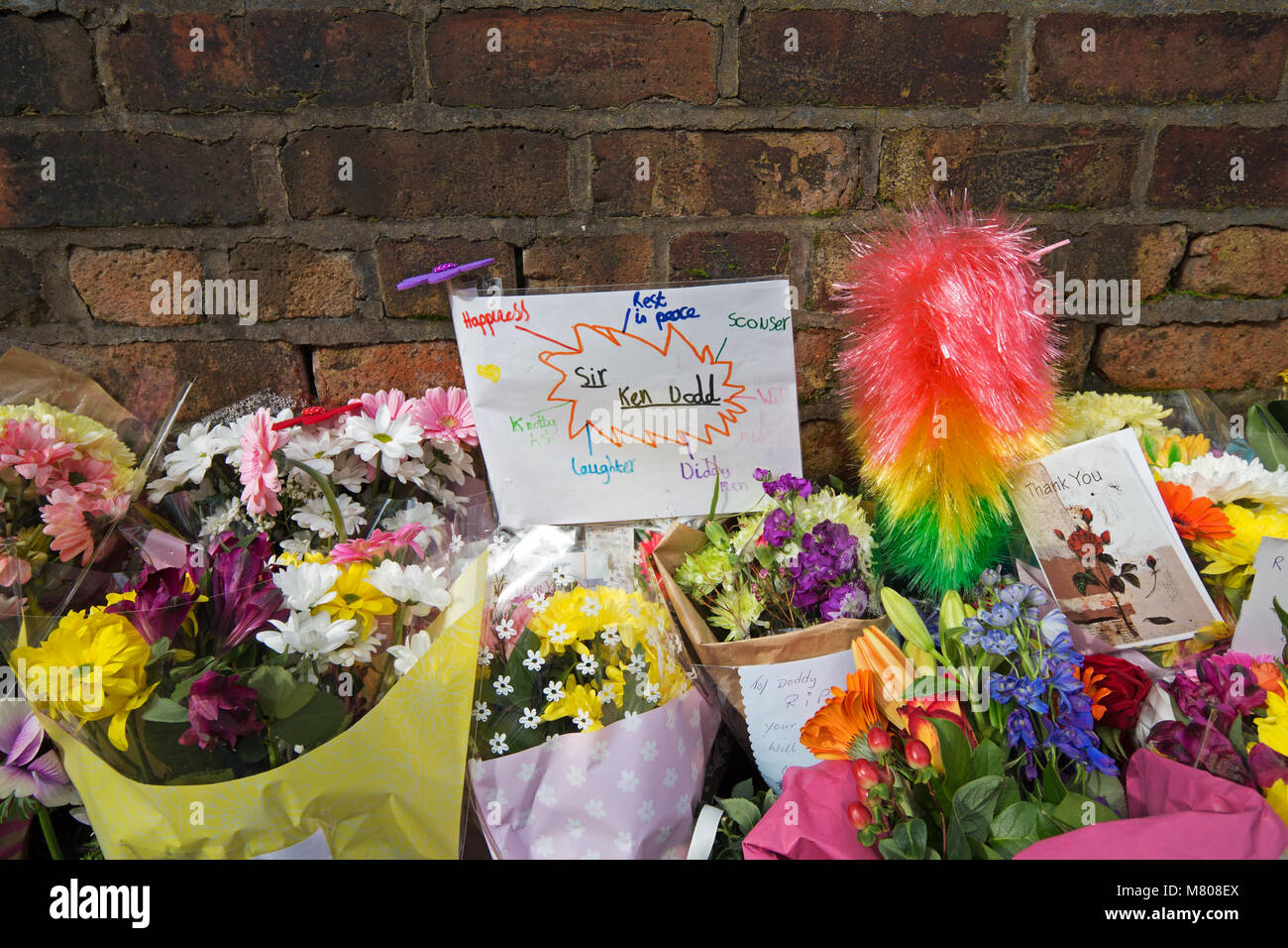 Knotty Ash, Liverpool, UK. 14th March 2018. Floral tributes being ...