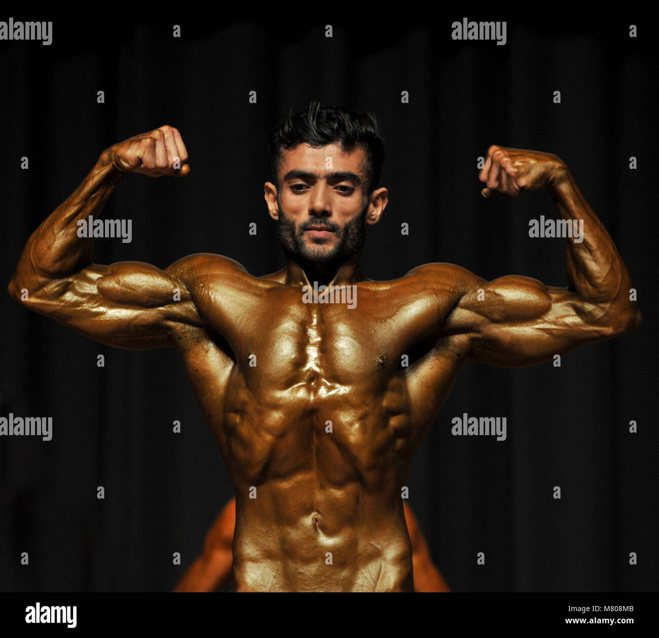 Jammu, Kashmir. 14th Mar, 2018. A participant performs during Mr. Jammu ...