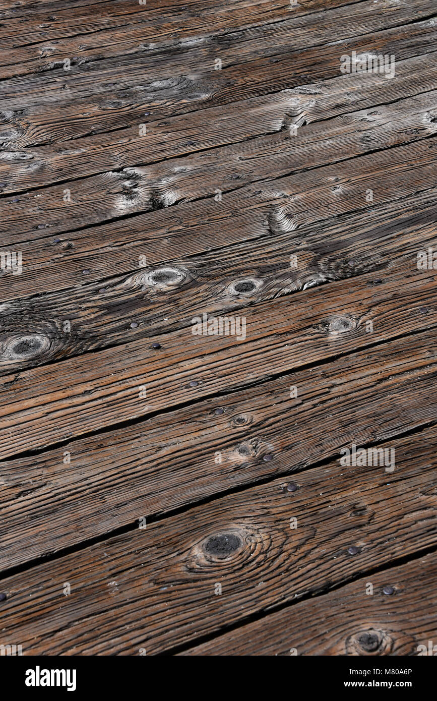 Aged worn timber boards from a pier - background texture Stock Photo ...