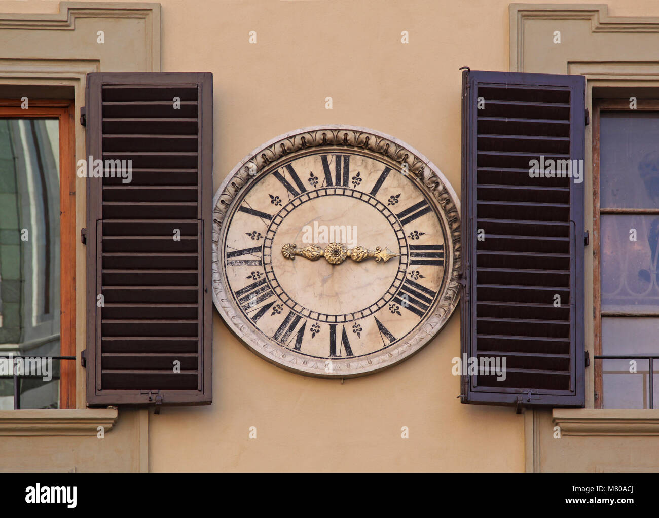Old public clock on retro building exterior Stock Photo - Alamy