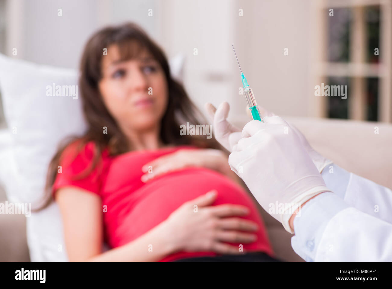 Pregnant woman patient visiting doctor for regular check-up Stock Photo ...