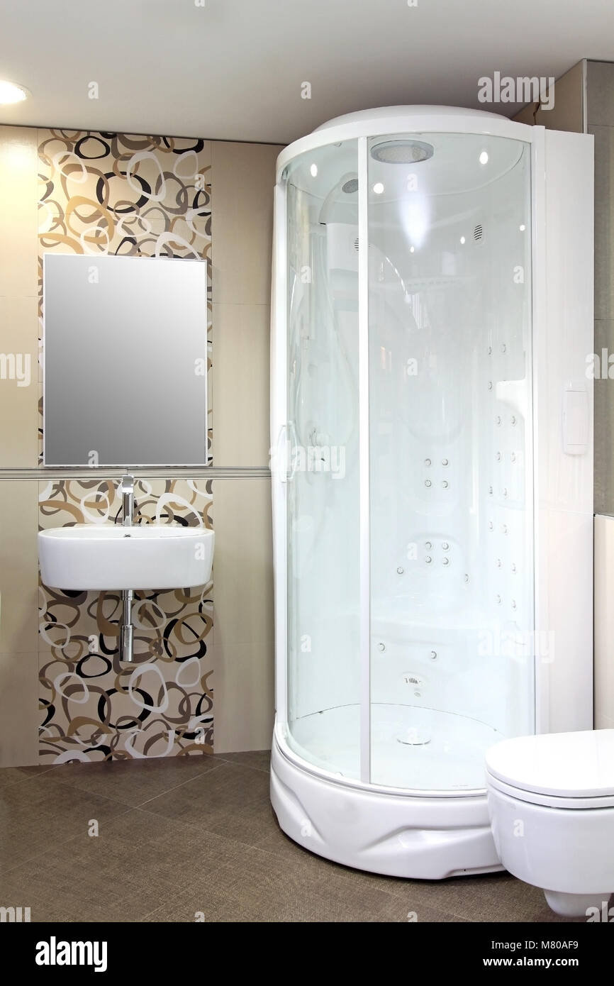 Small white shower cabin in bathroom interior Stock Photo - Alamy