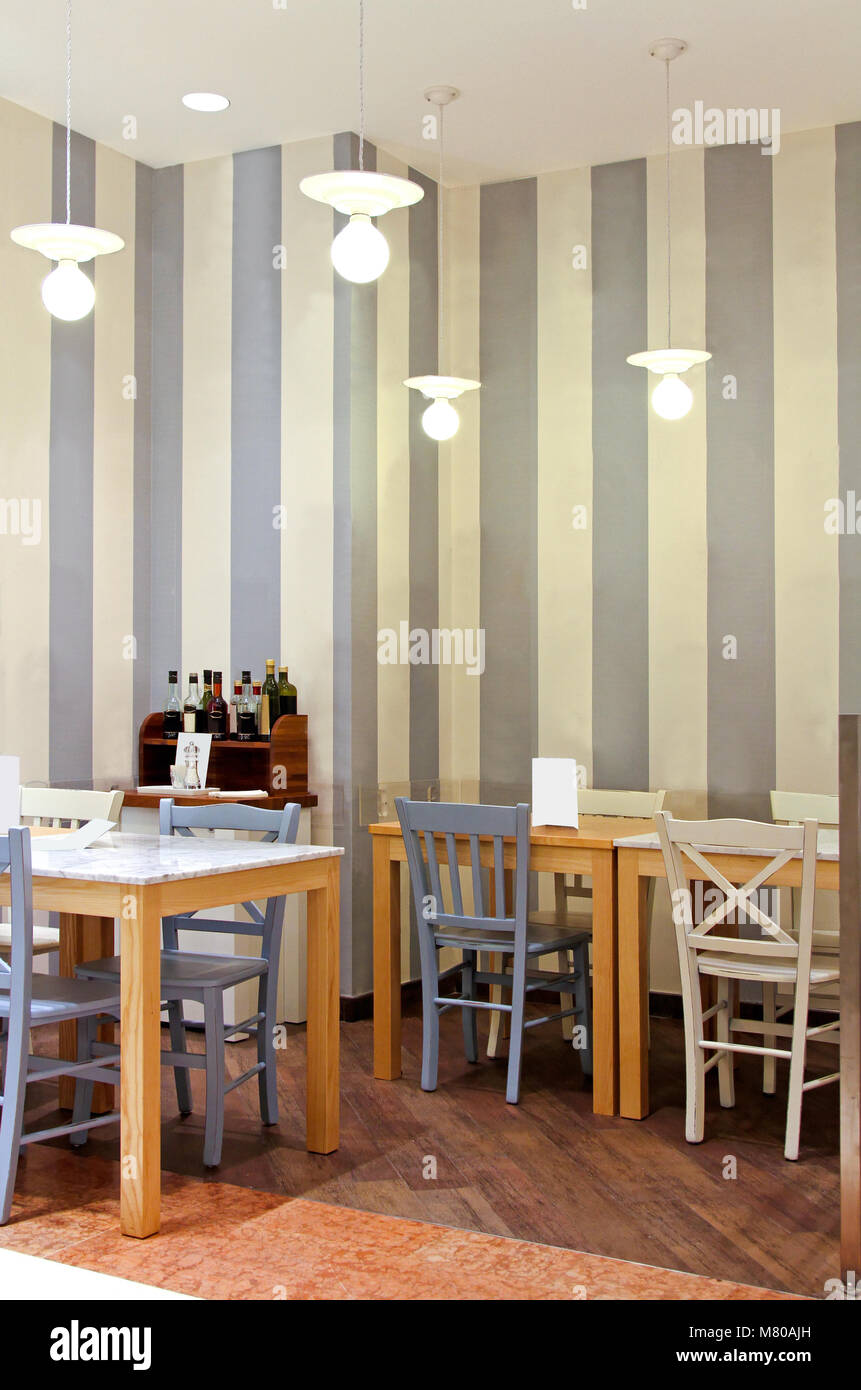 Retro small cafe interior with stripe walls and wooden furniture Stock ...