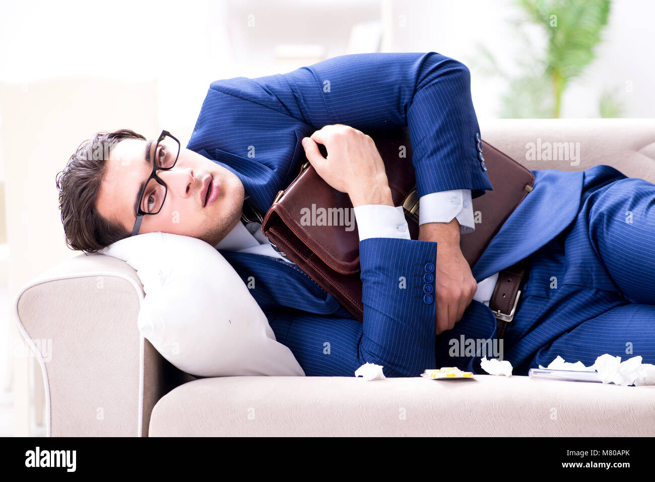 Sick employee staying at home suffering from flue Stock Photo - Alamy