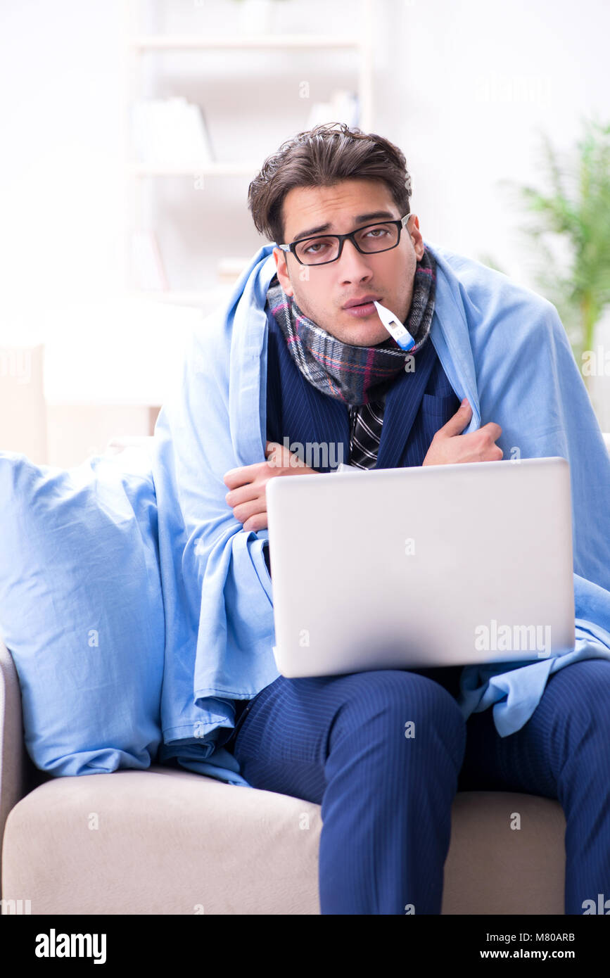 Sick businessman working from home due to flu sickness Stock Photo - Alamy