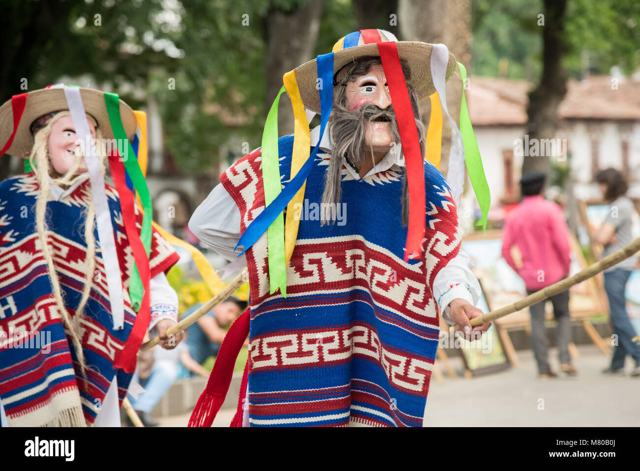 Costumed as old men traditional dancers perform the La Danza de los ...