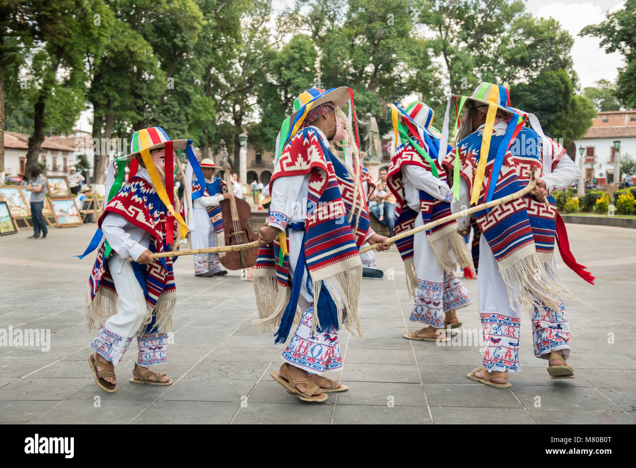 Costumed as old men traditional dancers perform the La Danza de los ...