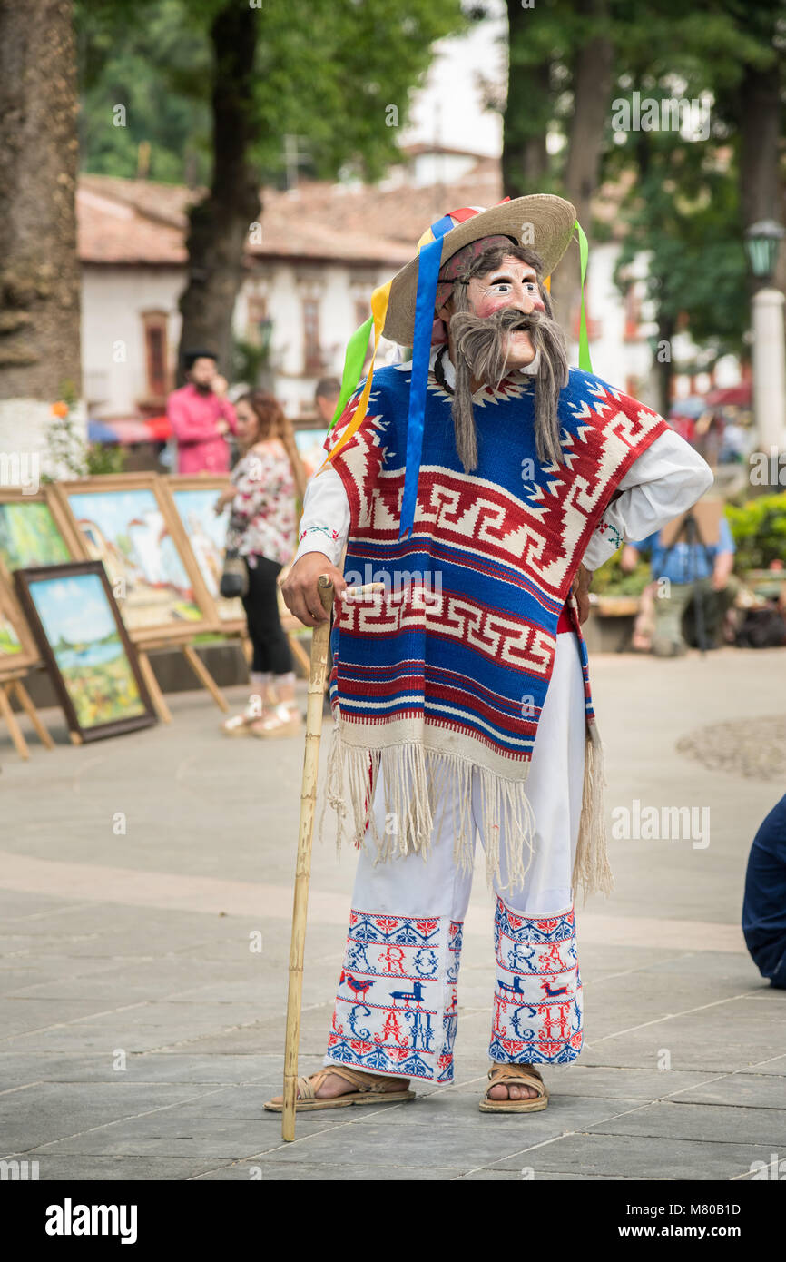 Costumed as old men traditional dancers perform the La Danza de los ...