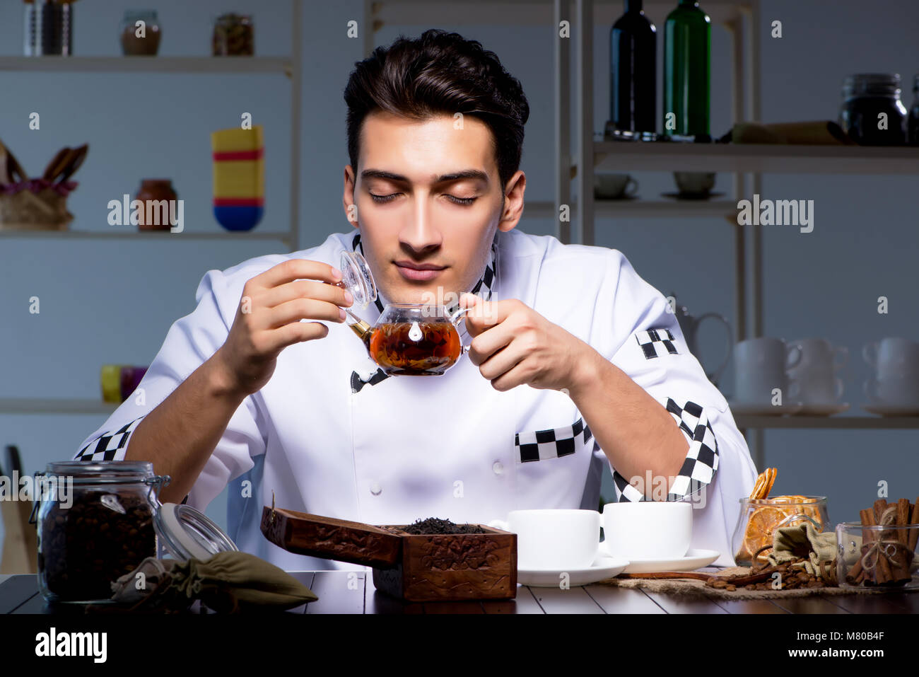 Tea expert brewing cup of drink Stock Photo - Alamy