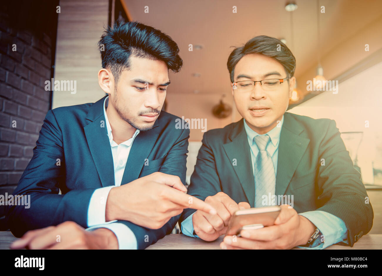 working on mobile for business goal and successful Stock Photo - Alamy