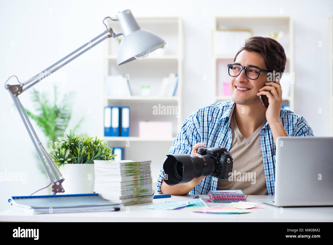 Young photographer working with his camera Stock Photo - Alamy