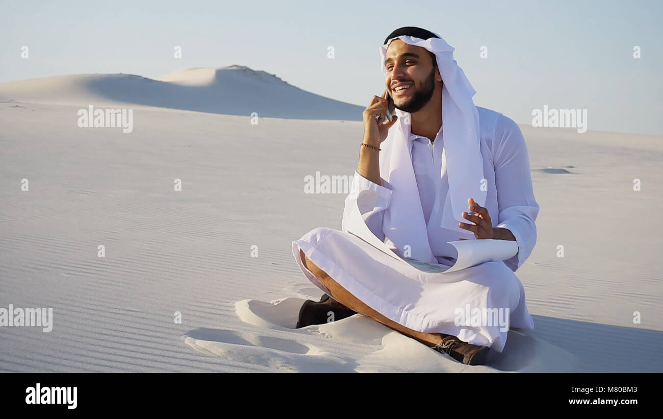 Successful Muslim Arabian UAE Sheikh architect communicates on p Stock ...