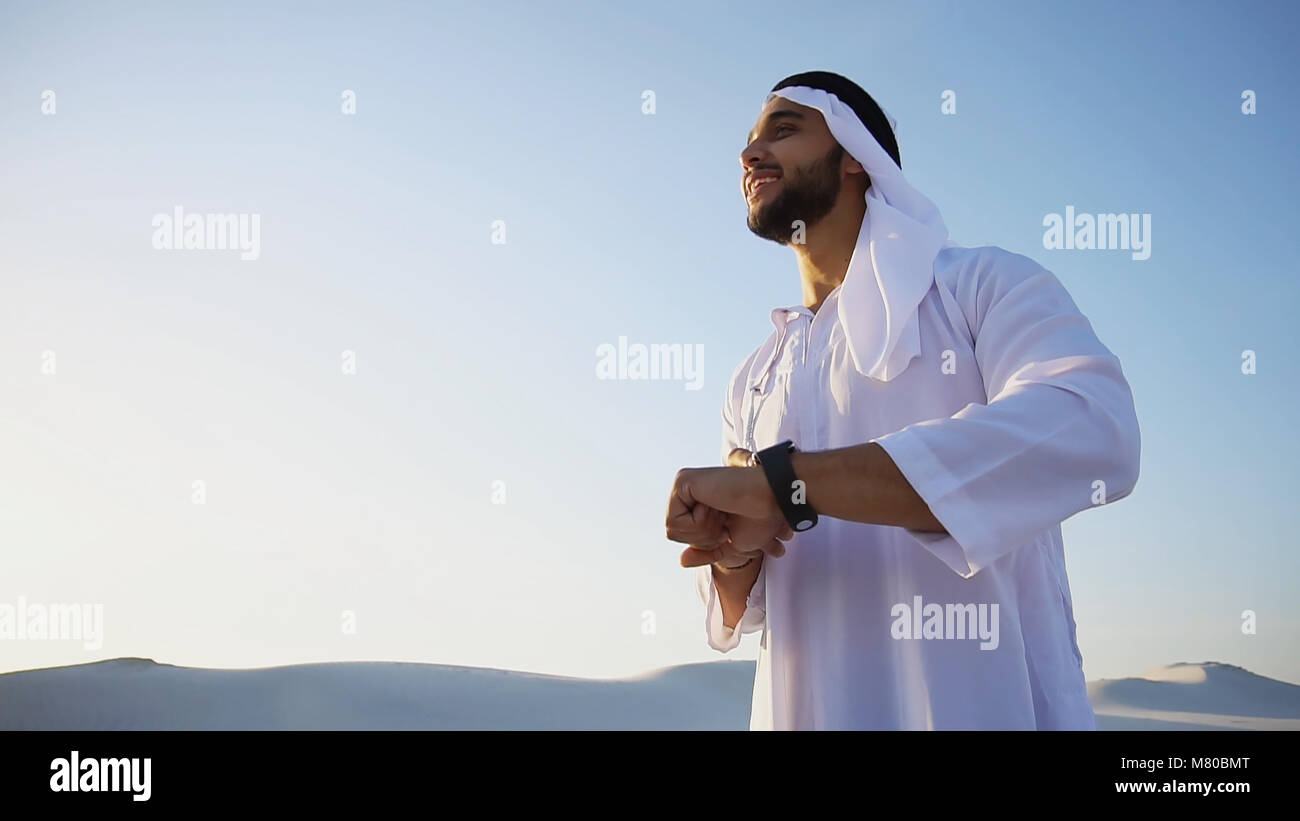 Good morning for male sheikh in middle of huge desert over cup o Stock ...
