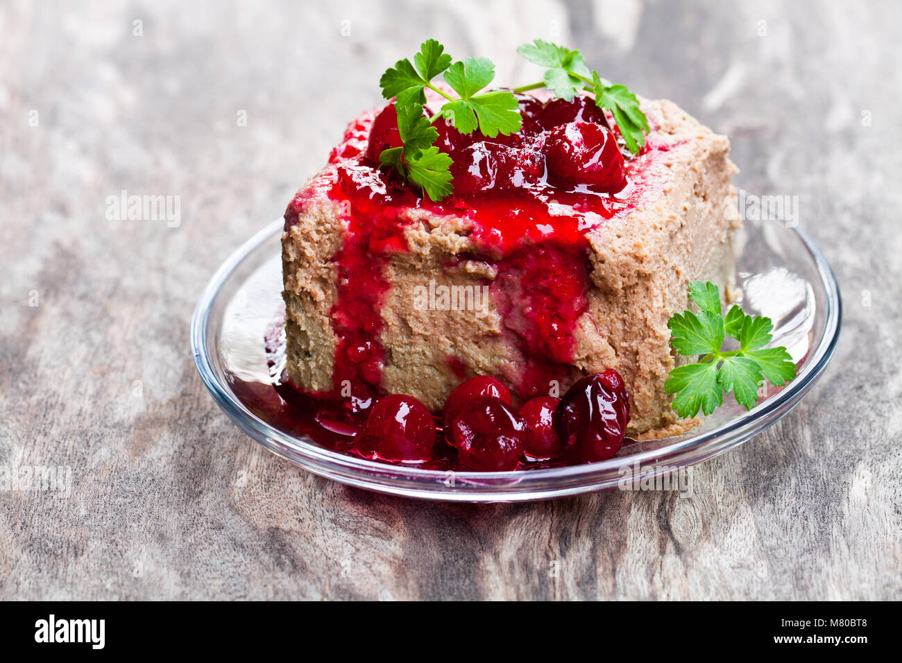poultry liver pate with cranberry sauce on a plate Stock Photo - Alamy