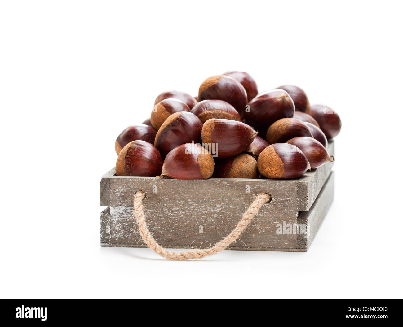 fresh raw chestnuts in a wooden box isolated on white background Stock ...