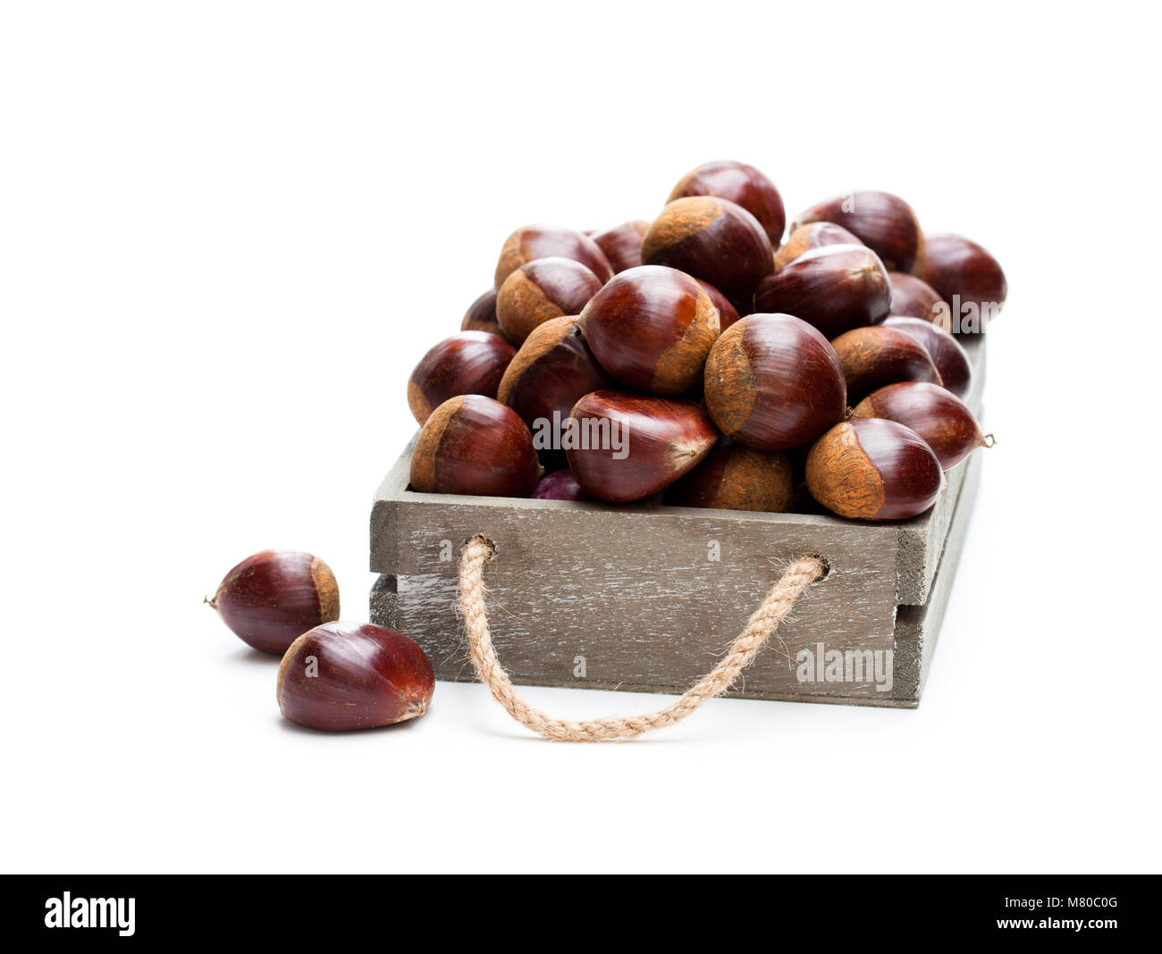 fresh raw chestnuts in a wooden box isolated on white background Stock ...