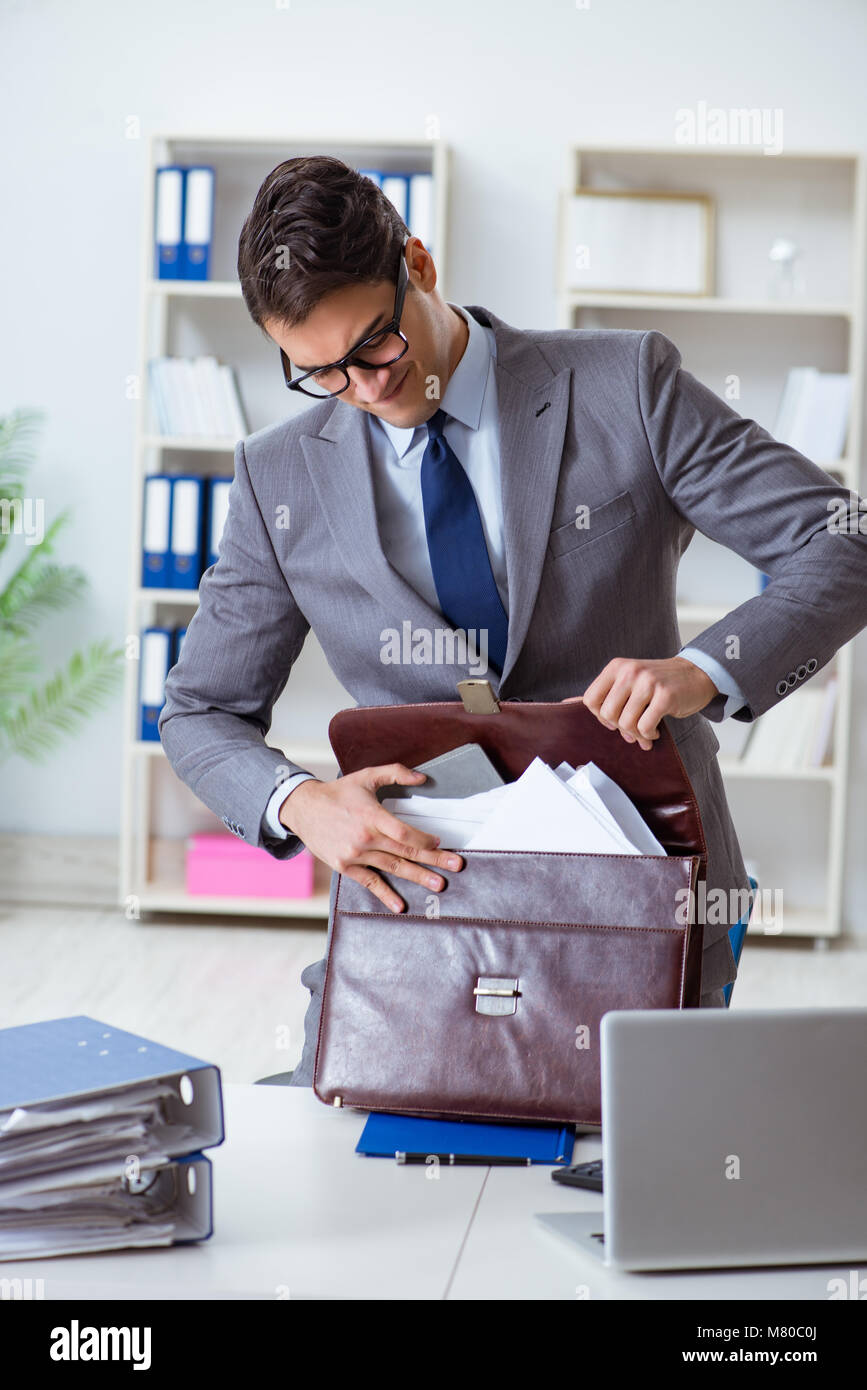 Employee with too much work taking it home Stock Photo - Alamy