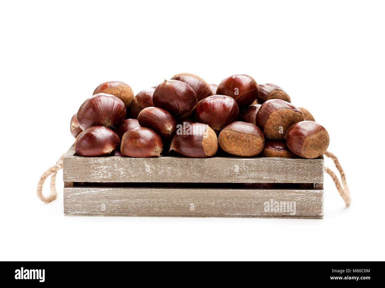 fresh raw chestnuts in a wooden box isolated on white background Stock ...
