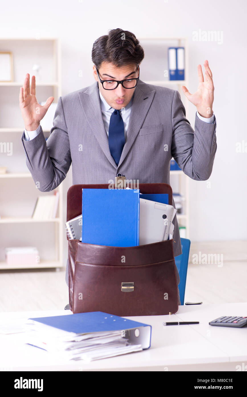 Employee with too much work taking it home Stock Photo - Alamy