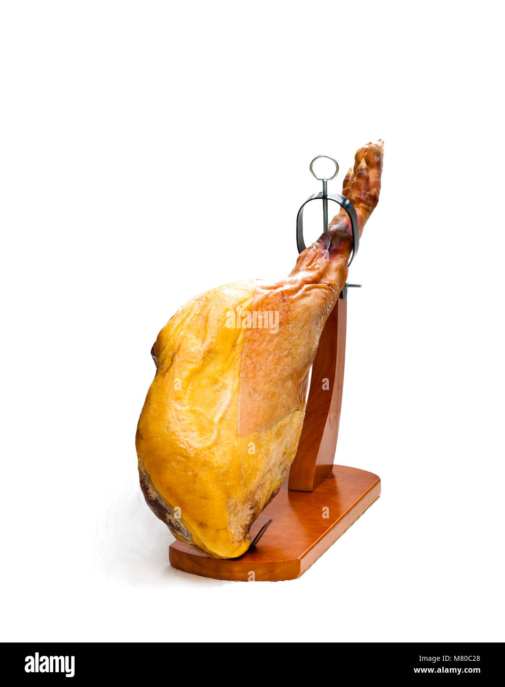 Whole jamon on a wooden stand isolated on white background Stock Photo ...