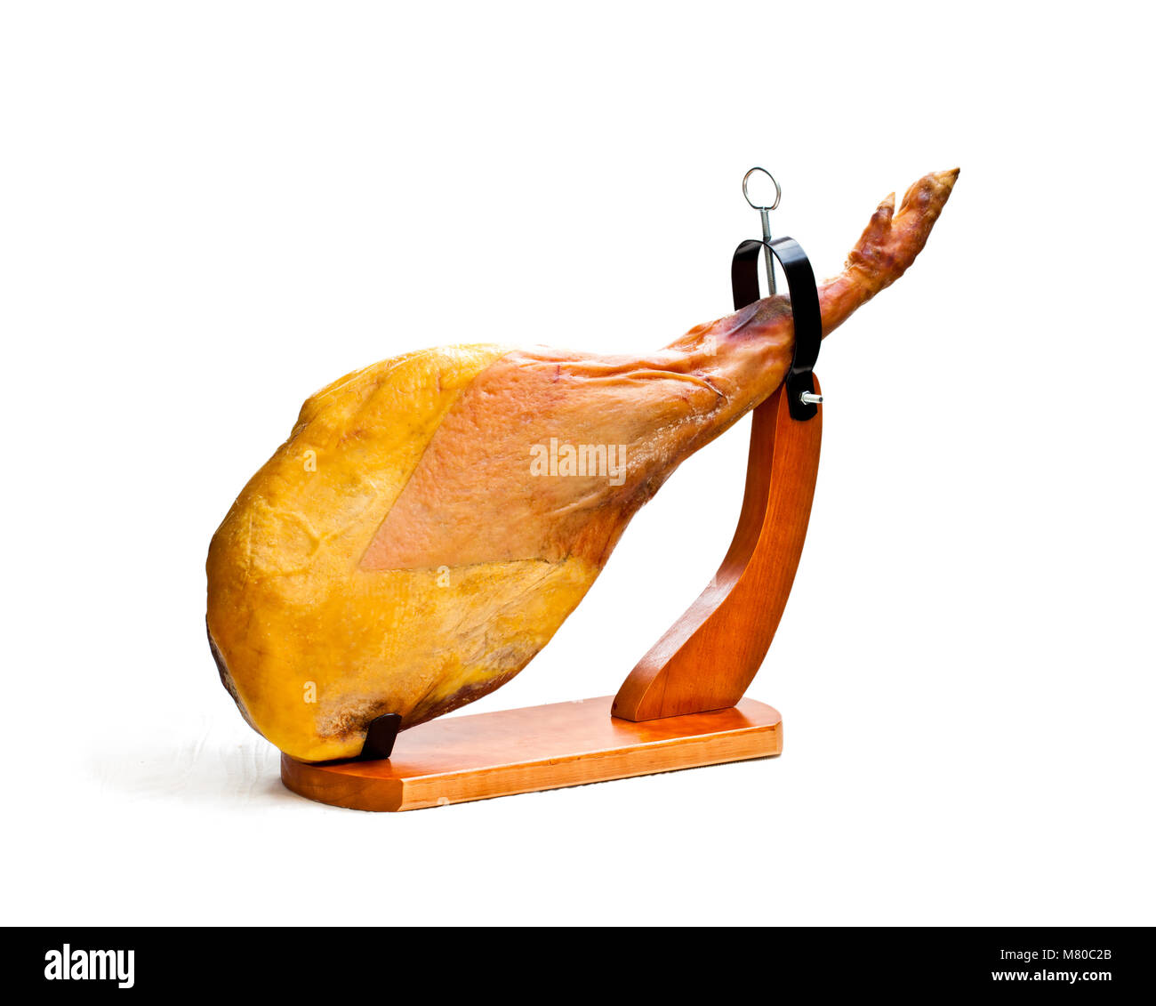 Whole jamon on a wooden stand isolated on white background Stock Photo ...